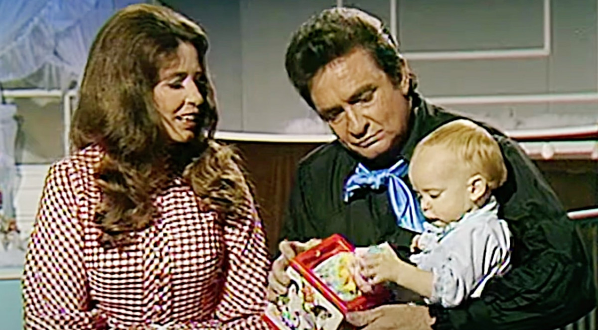 Johnny and June Show The World Their Baby Boy In Sweet On-Stage Moment
