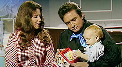 Johnny and June Show The World Their Baby Boy In Sweet On-Stage Moment